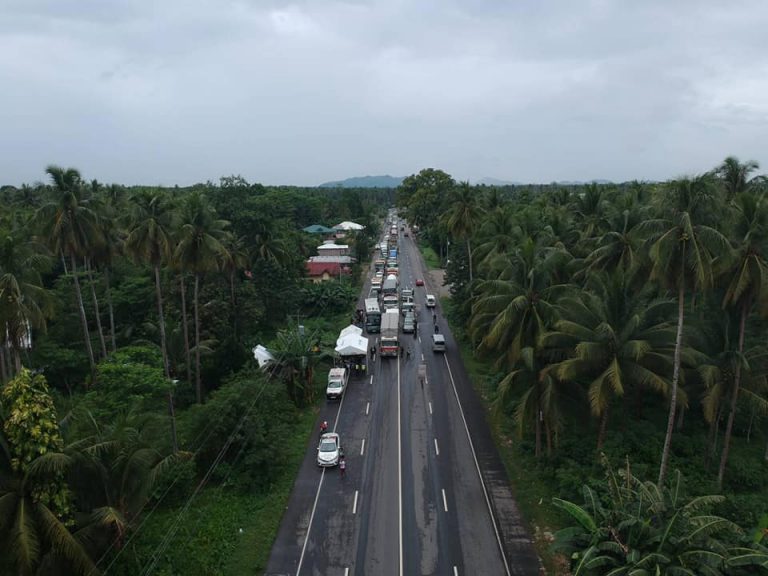 Aerial View of Vehicles Entering Butuan City Stuck in Long Traffic